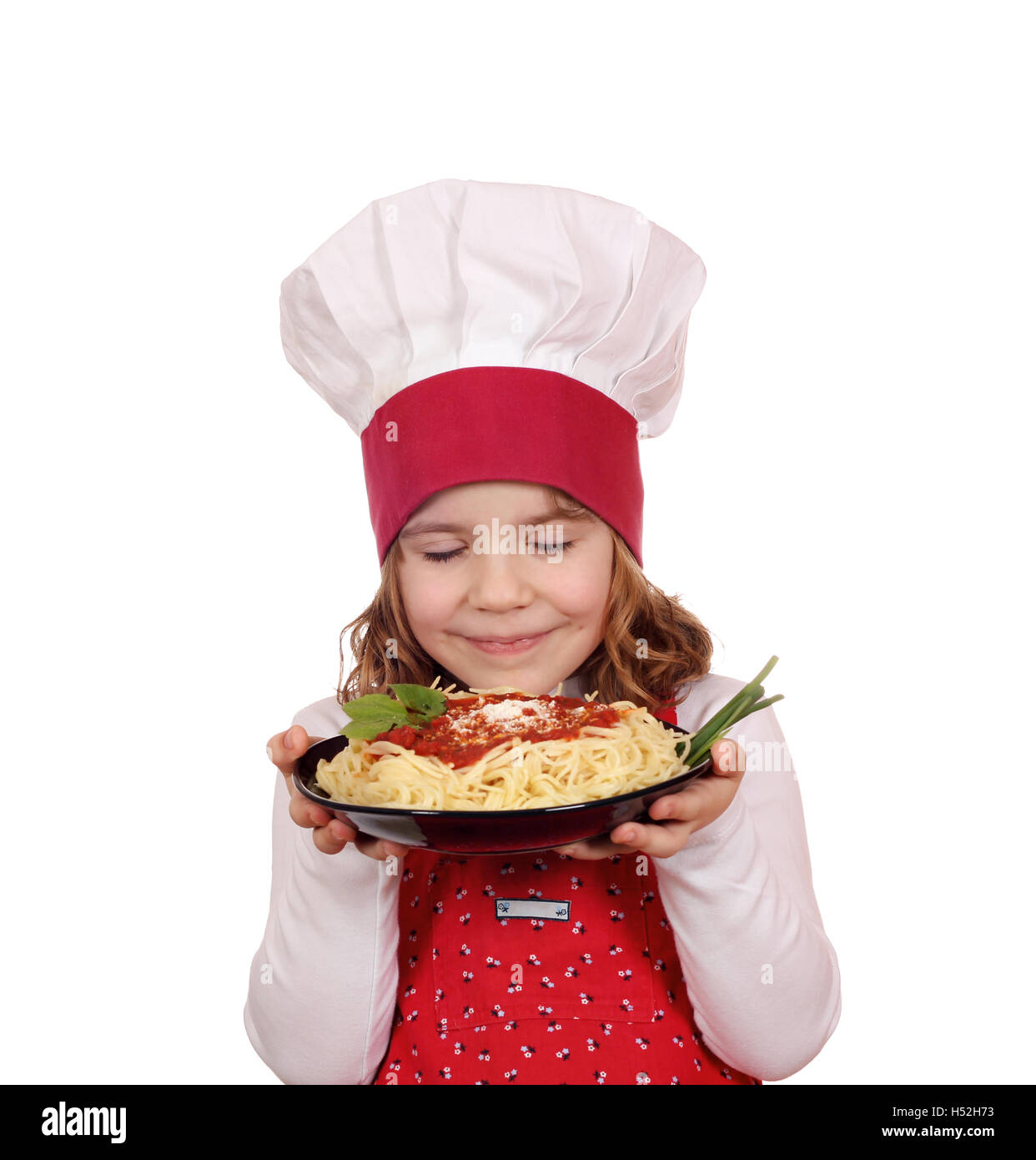 little girl cook enjoys spaghetti Stock Photo - Alamy