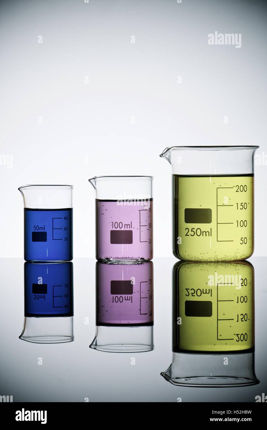 group of laboratory beakers containing liquid color Stock Photo - Alamy