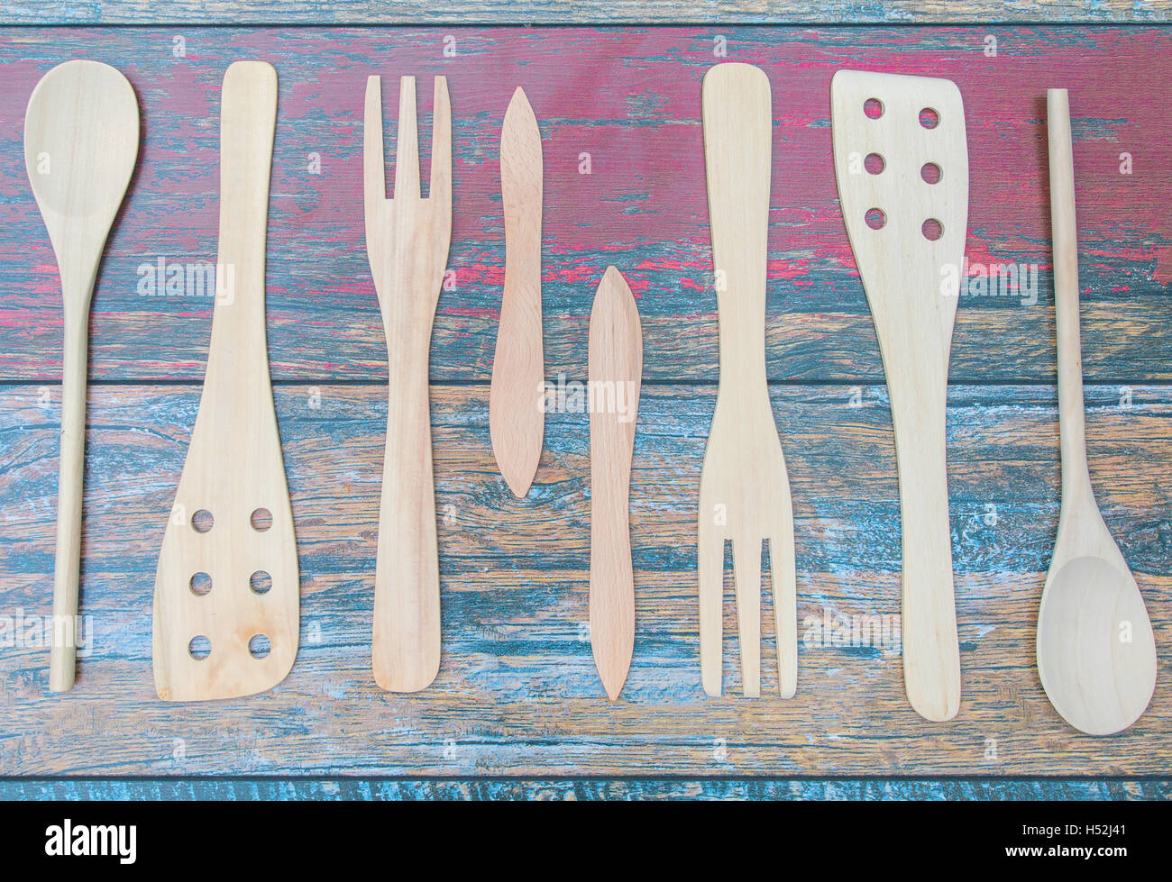 Wooden, decorative kitchen utensils with a broken spoon Stock Photo - Alamy