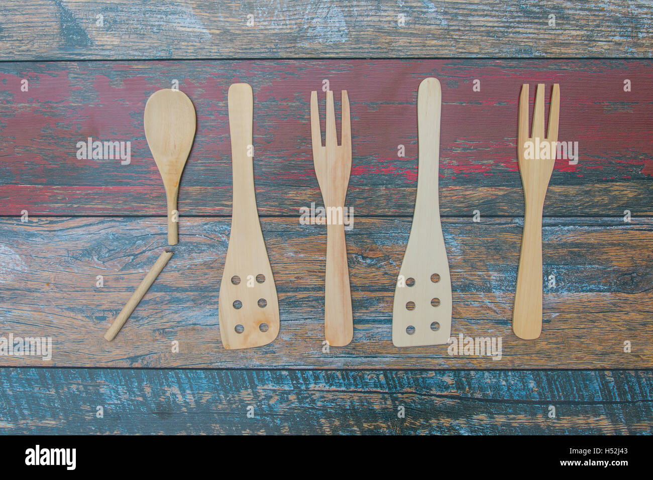 Wooden, decorative kitchen utensils with a broken spoon Stock Photo - Alamy