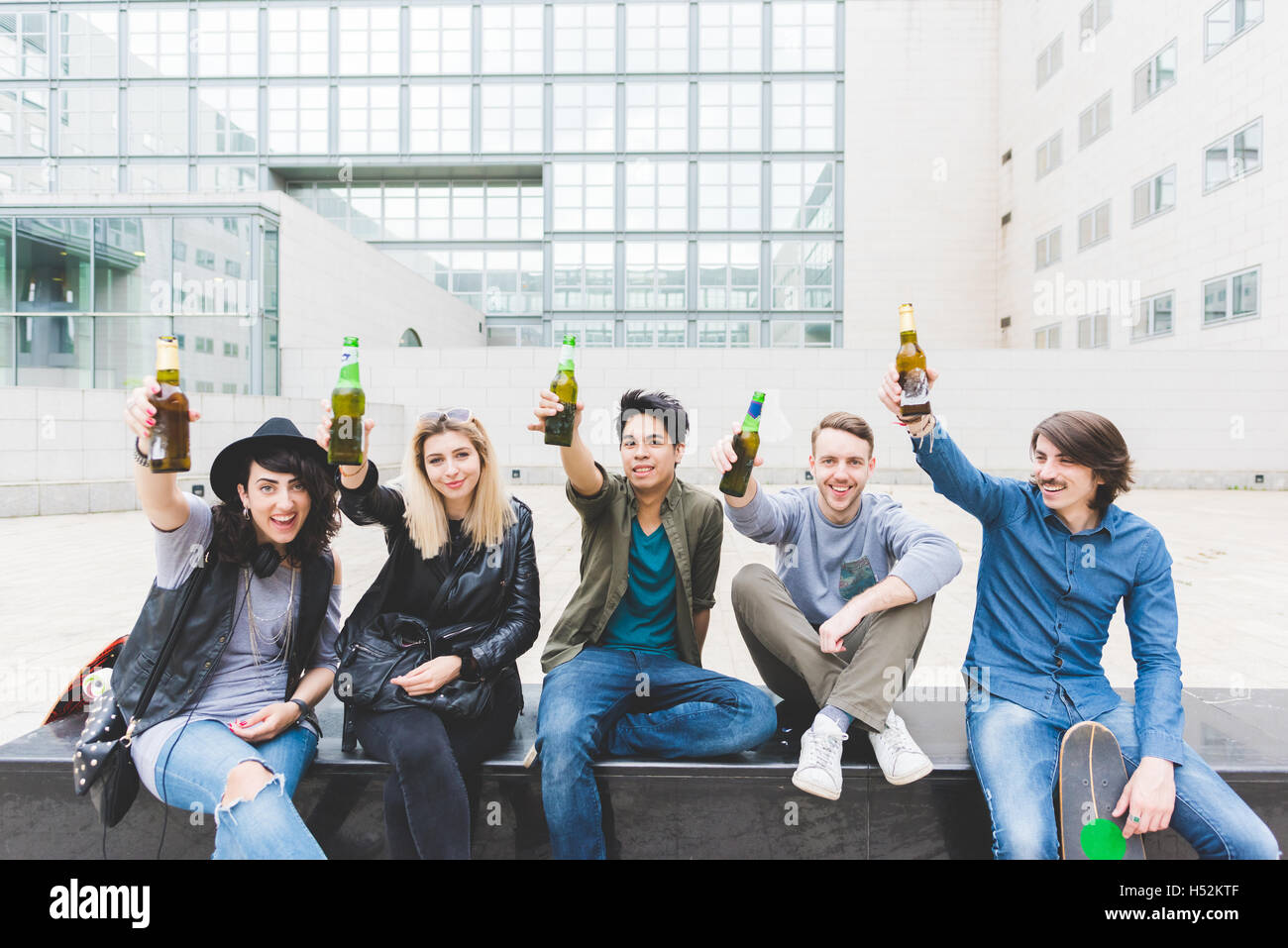 Group of young handsome multiethnic woman and man friends making a ...