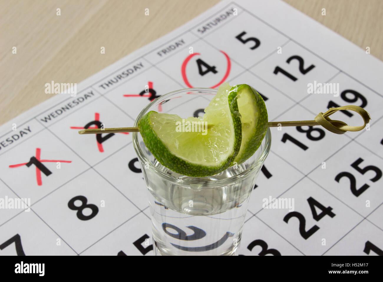 Red color writing on the calendar at friday with shot of tequila with a ...