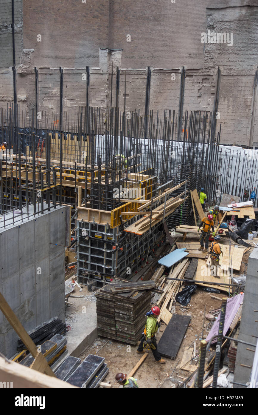 Preparing the foundation for a new building going up along Fulton ...