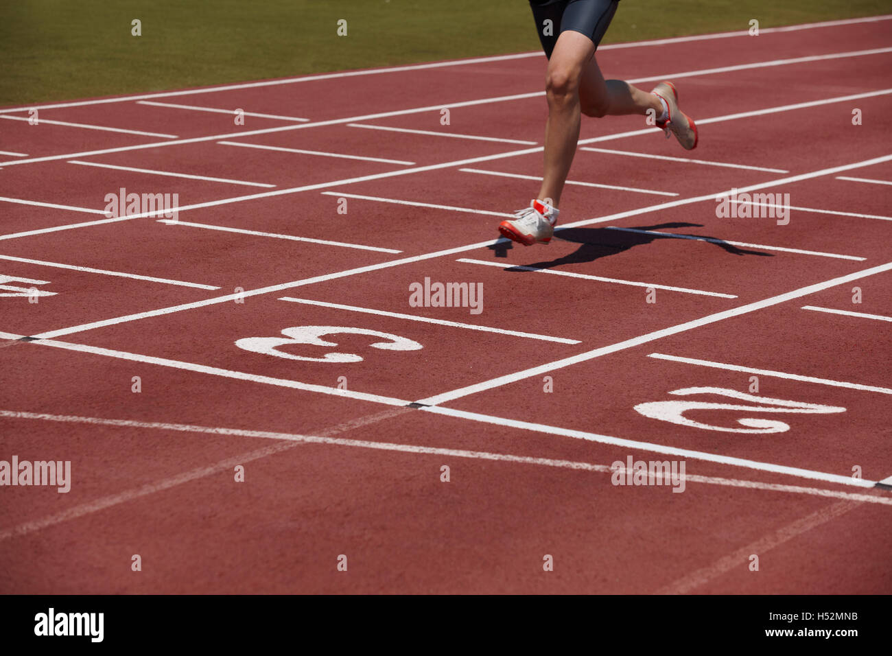 Detail of a male athlete in a running track. Horizontal Stock Photo - Alamy