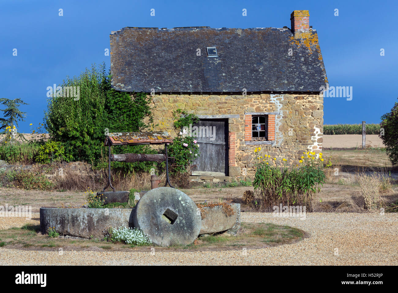 An old rustic farm building in the countryside of Normandie-Maine in ...
