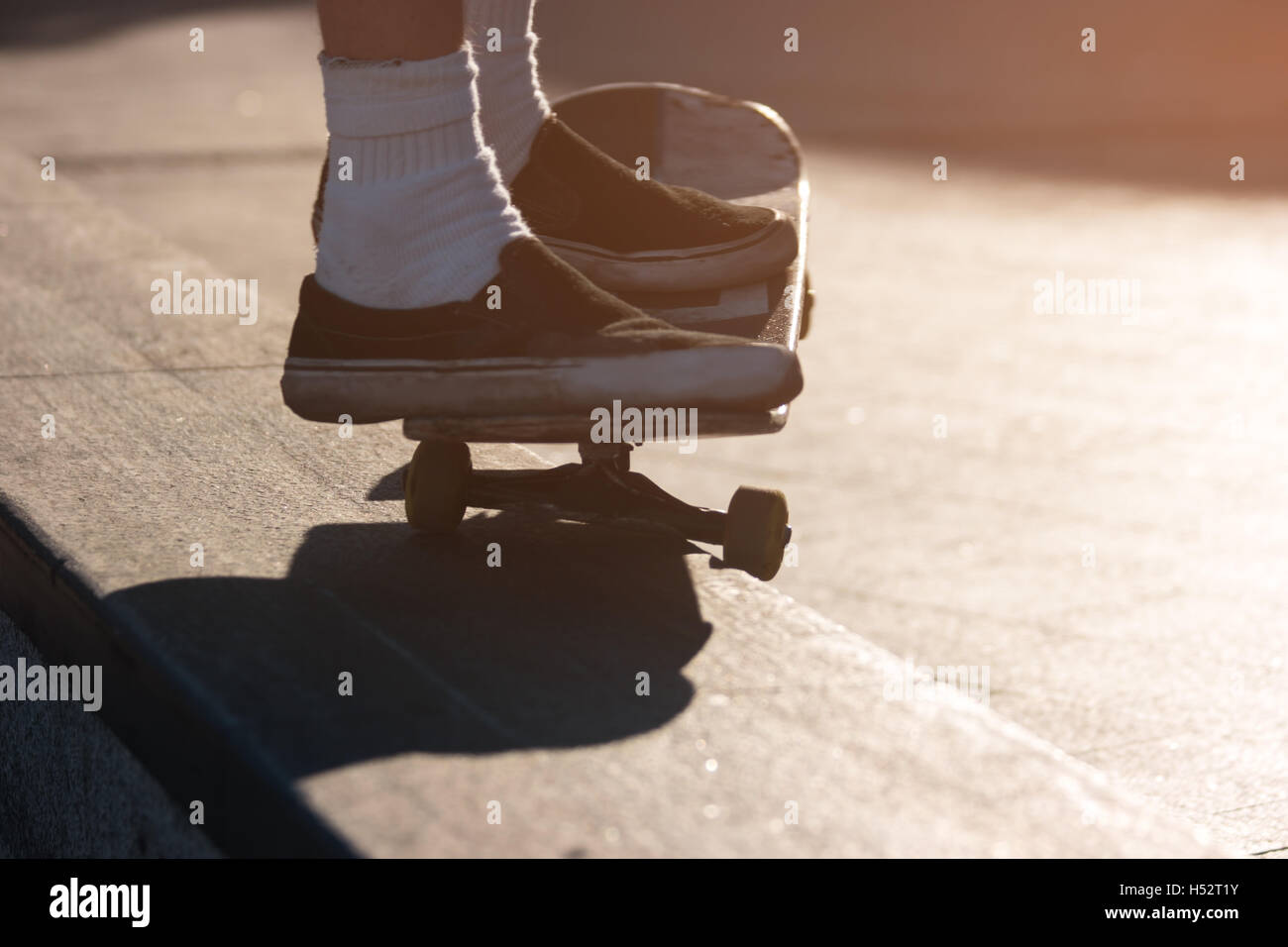 Feet on a skateboard. Skater performs a trick. Tutorial for perfect ...