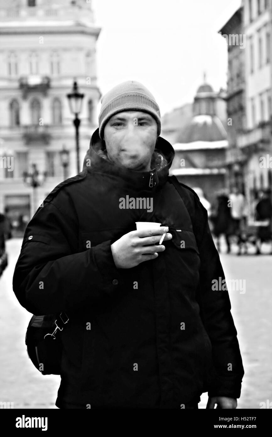 Stylish man smoking cigarette Black and White Stock Photos & Images - Alamy