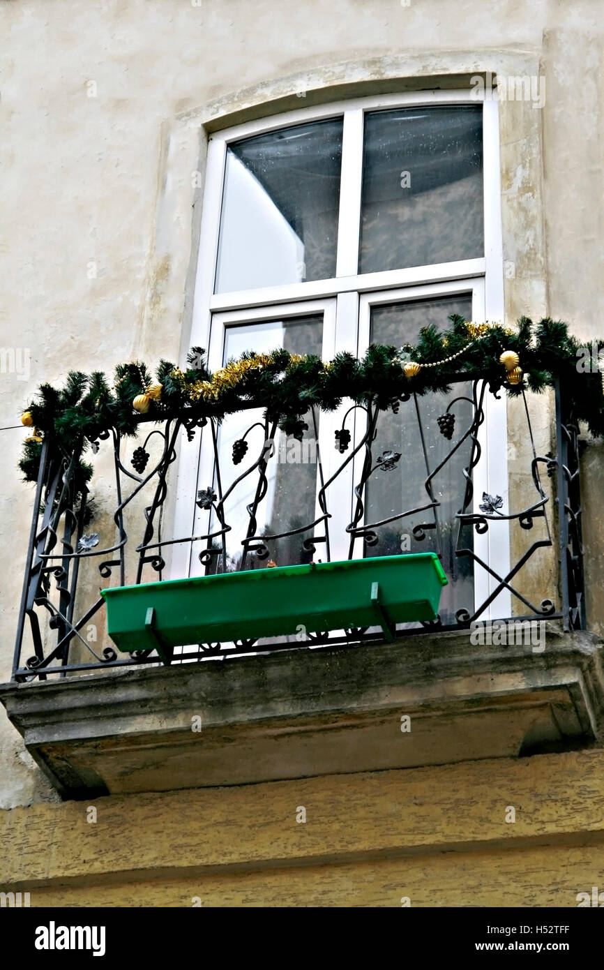 Balcony decorated Christmas fir garland Stock Photo - Alamy