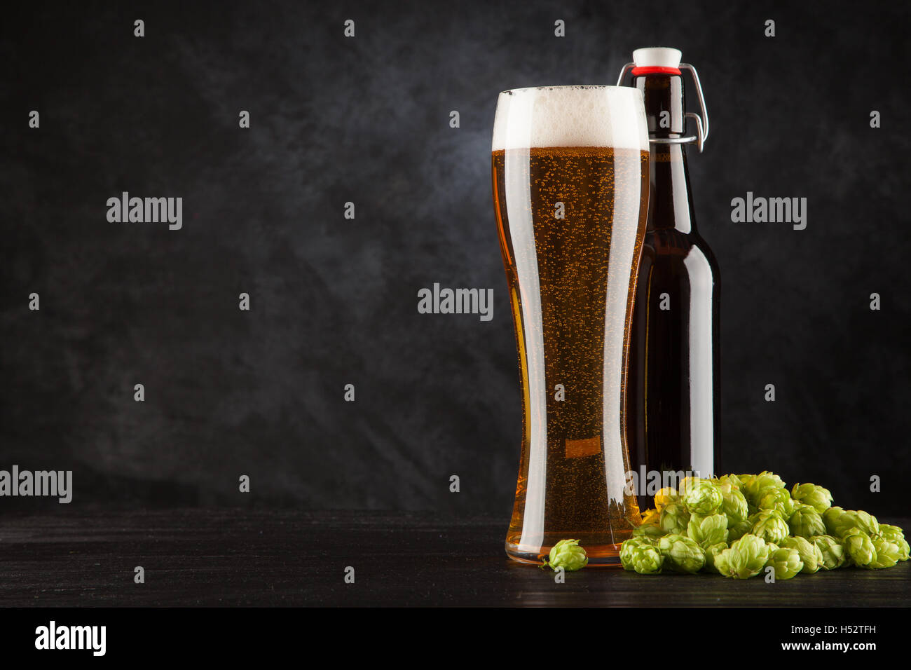 Beer glass on dark background Stock Photo - Alamy