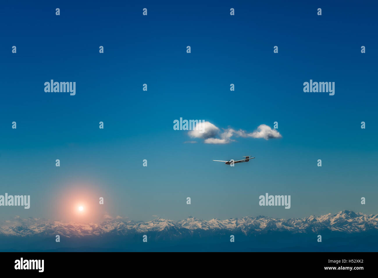 glider flying over the Alps Stock Photo - Alamy