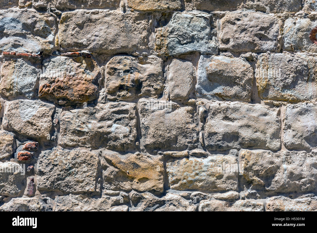 Background from an rough brown natural stone wall Stock Photo - Alamy