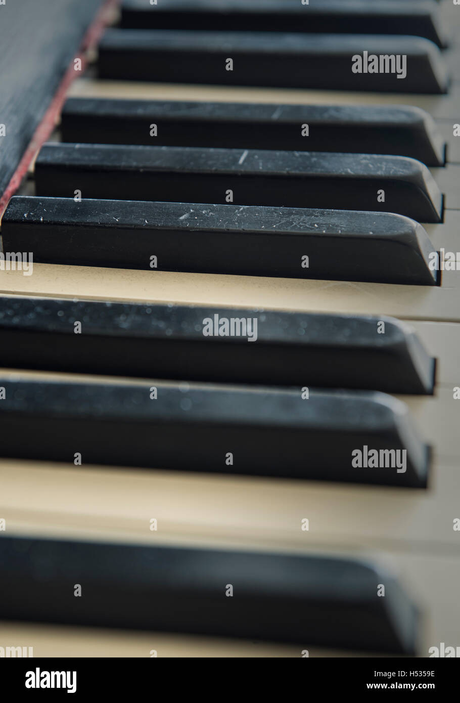 Close up of the keys on an old upright piano Stock Photo - Alamy