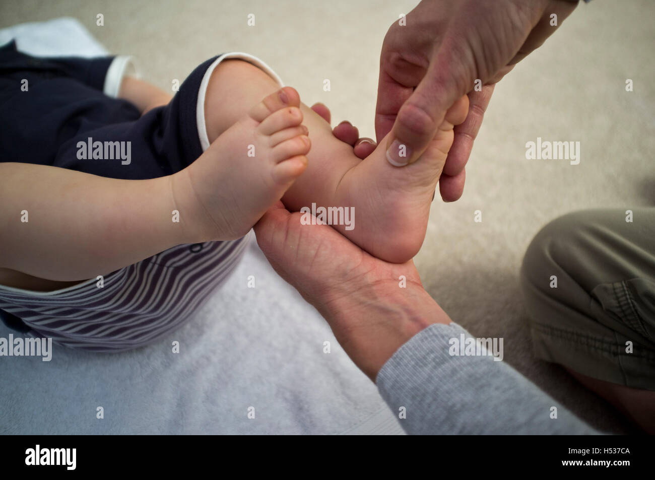 dh Reflexology HEALTH UK Baby infant bare feet therapy patient child ...