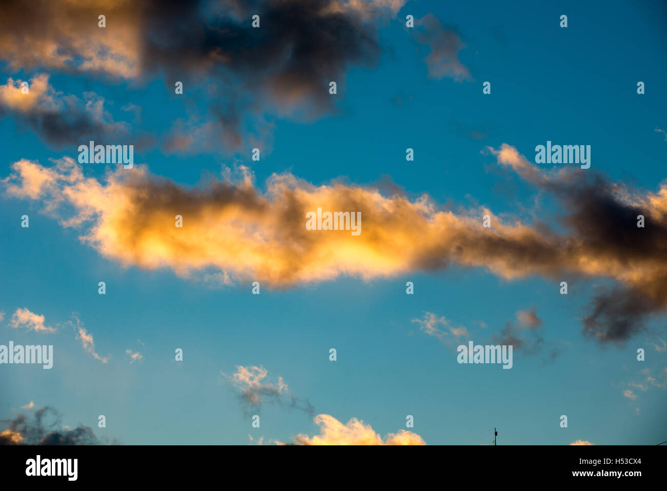 Puffy and colorful sunset clouds Stock Photo - Alamy