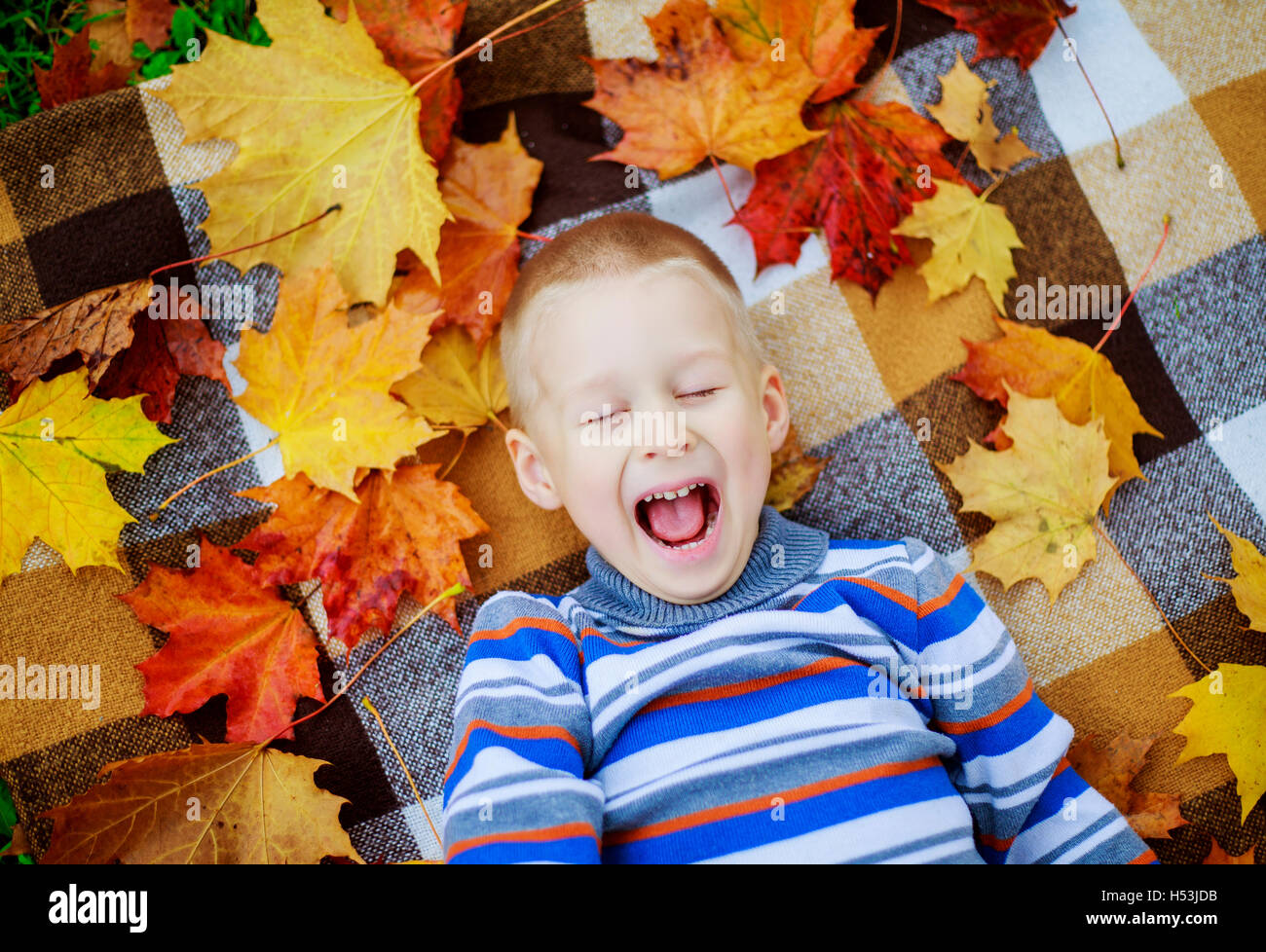 Boy relaxing in a park hi-res stock photography and images - Alamy