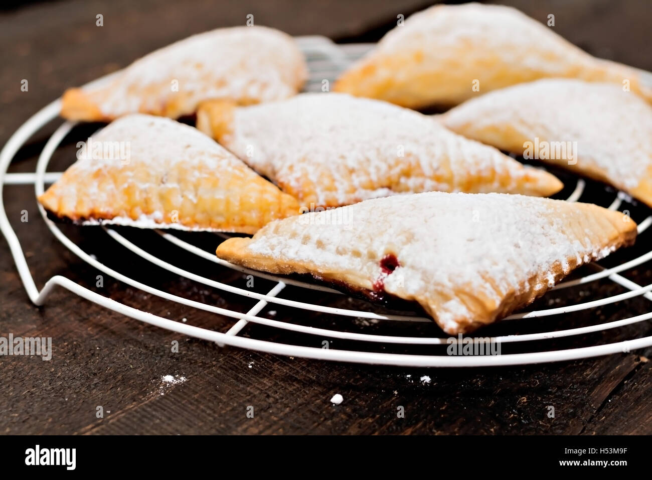 layered angles with cherry under powdered sugar Stock Photo - Alamy