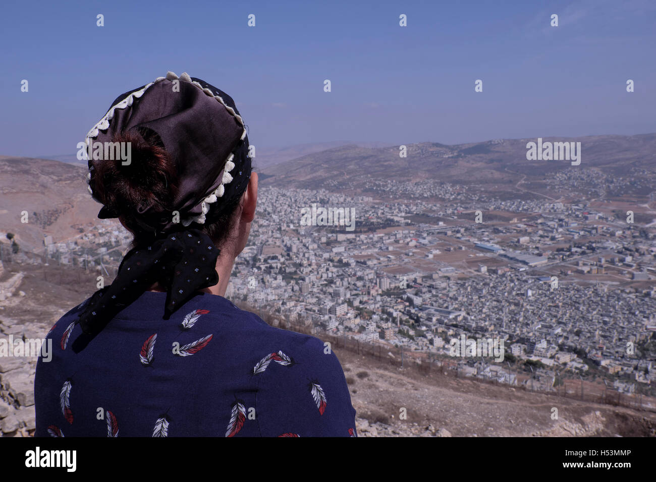 A religious Jewish settler gazing from an observation point on Mount ...