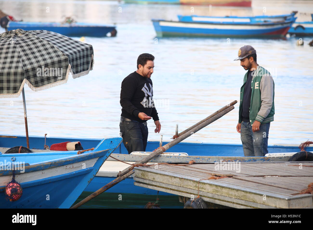 Fish men setting themselves for fishing Stock Photo - Alamy