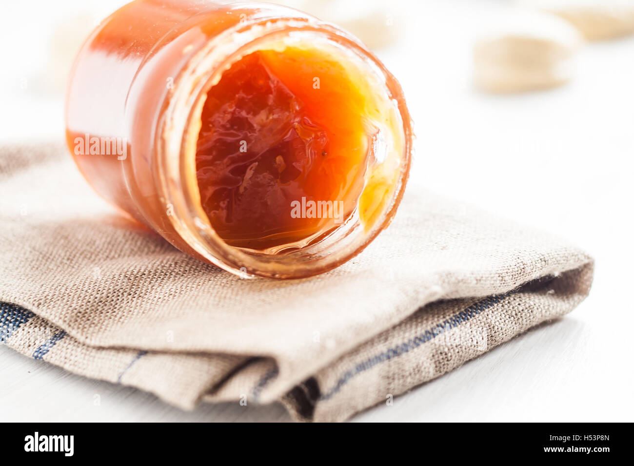 dense jam in jar spoon Stock Photo - Alamy