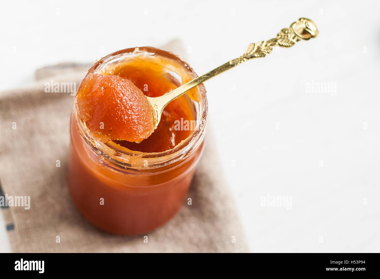 dense jam in jar spoon Stock Photo - Alamy