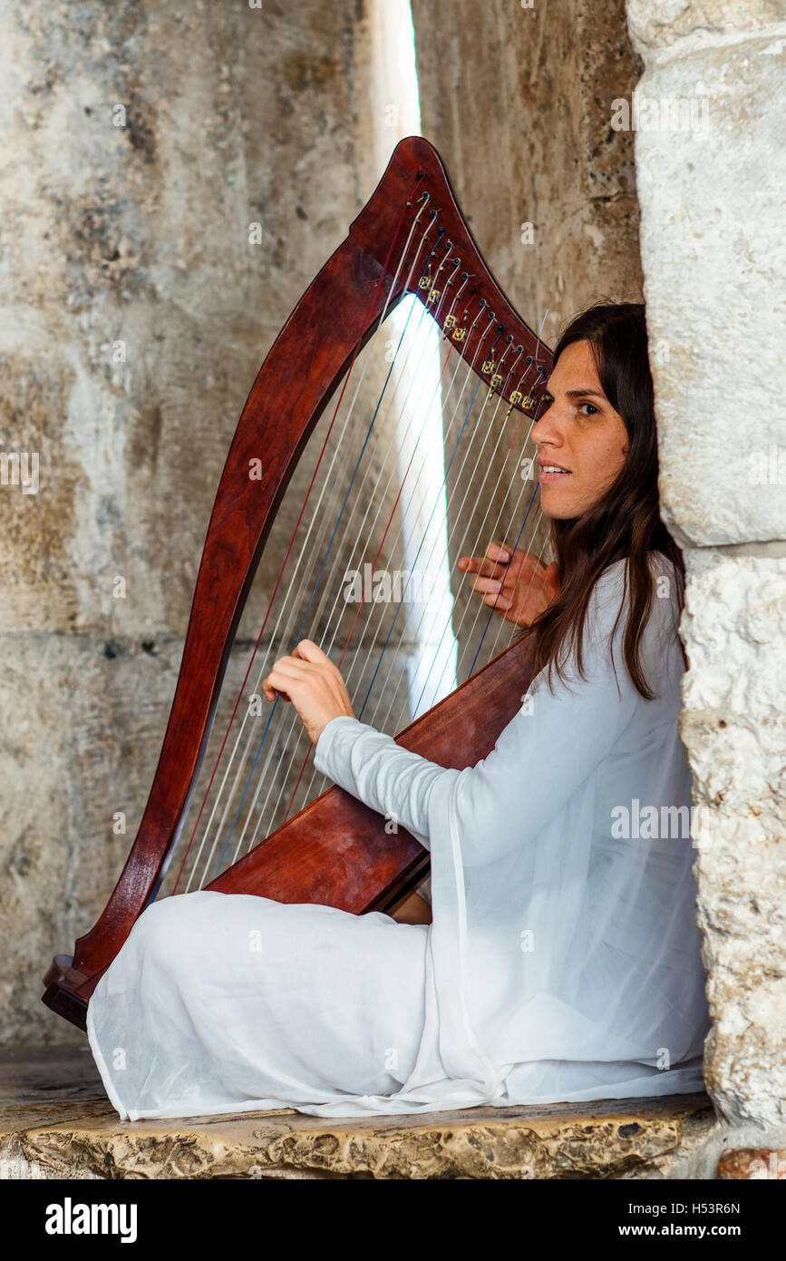 Jerusalem, Israel- 2 may 2015 - Girl harp player in the street Stock ...