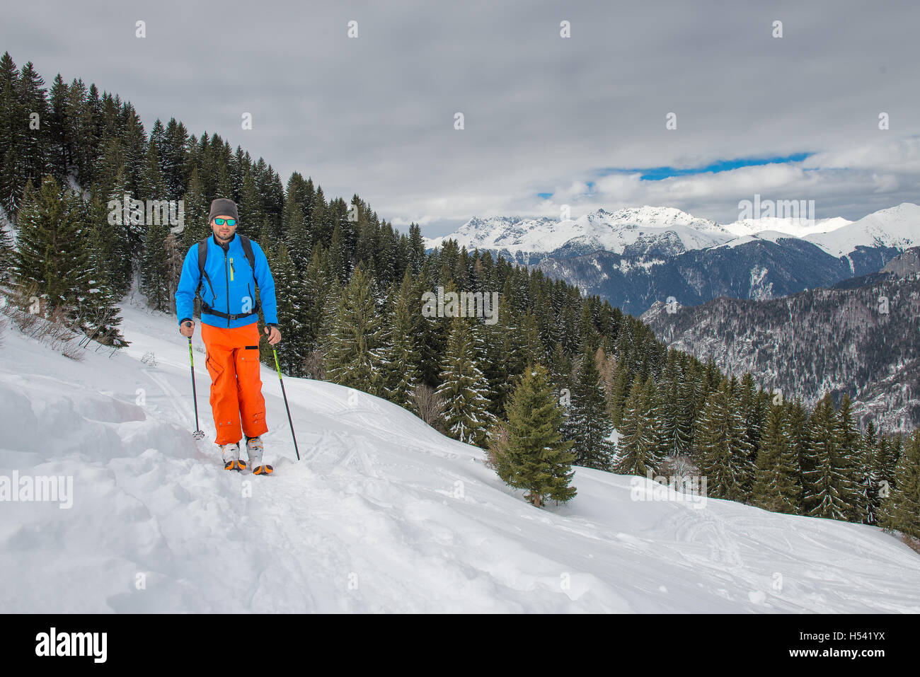 A man alone in the mountains with ski mountaineering Stock Photo - Alamy