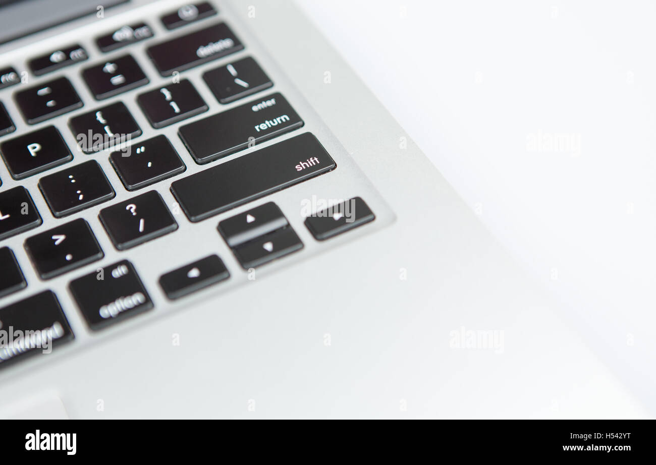closeup shot with focus on shift key. black keys of a laptop keyboard ...