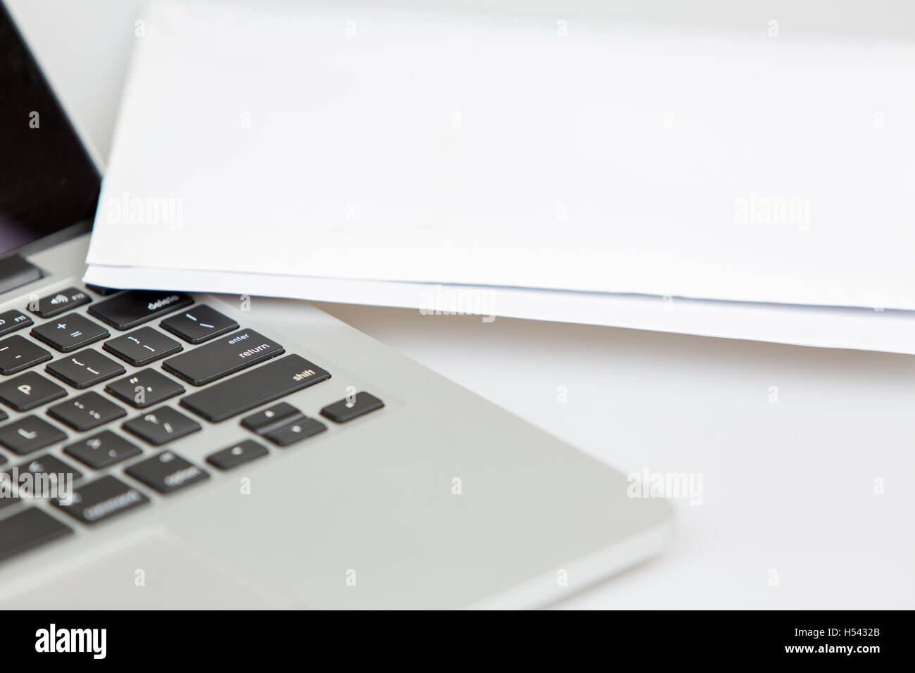 Laptop with paper hi-res stock photography and images - Alamy