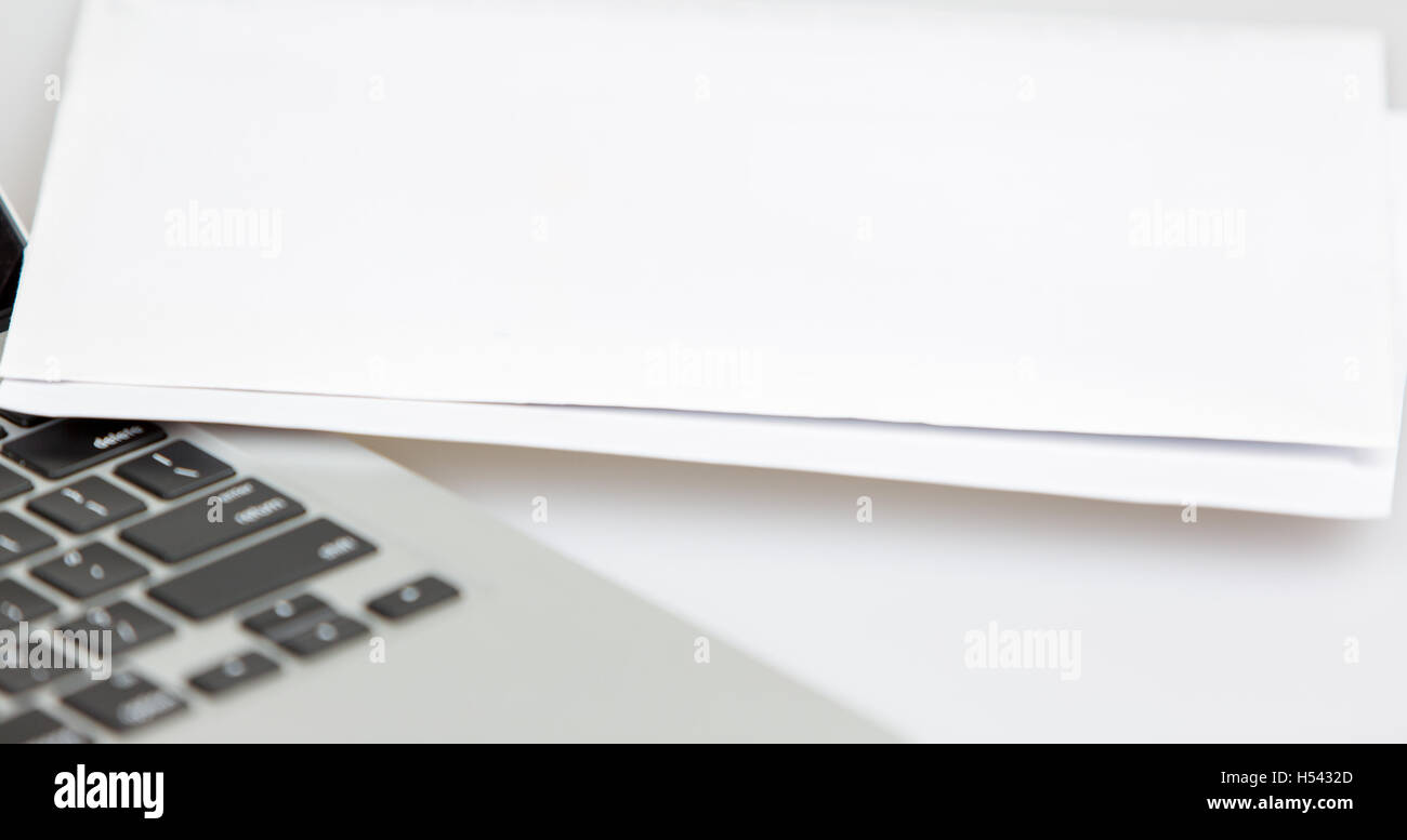 Laptop with paper hi-res stock photography and images - Alamy