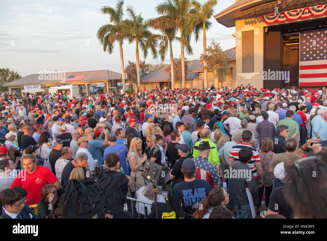 A crowd listens while Donald J Trump speaks to supporters at his ...