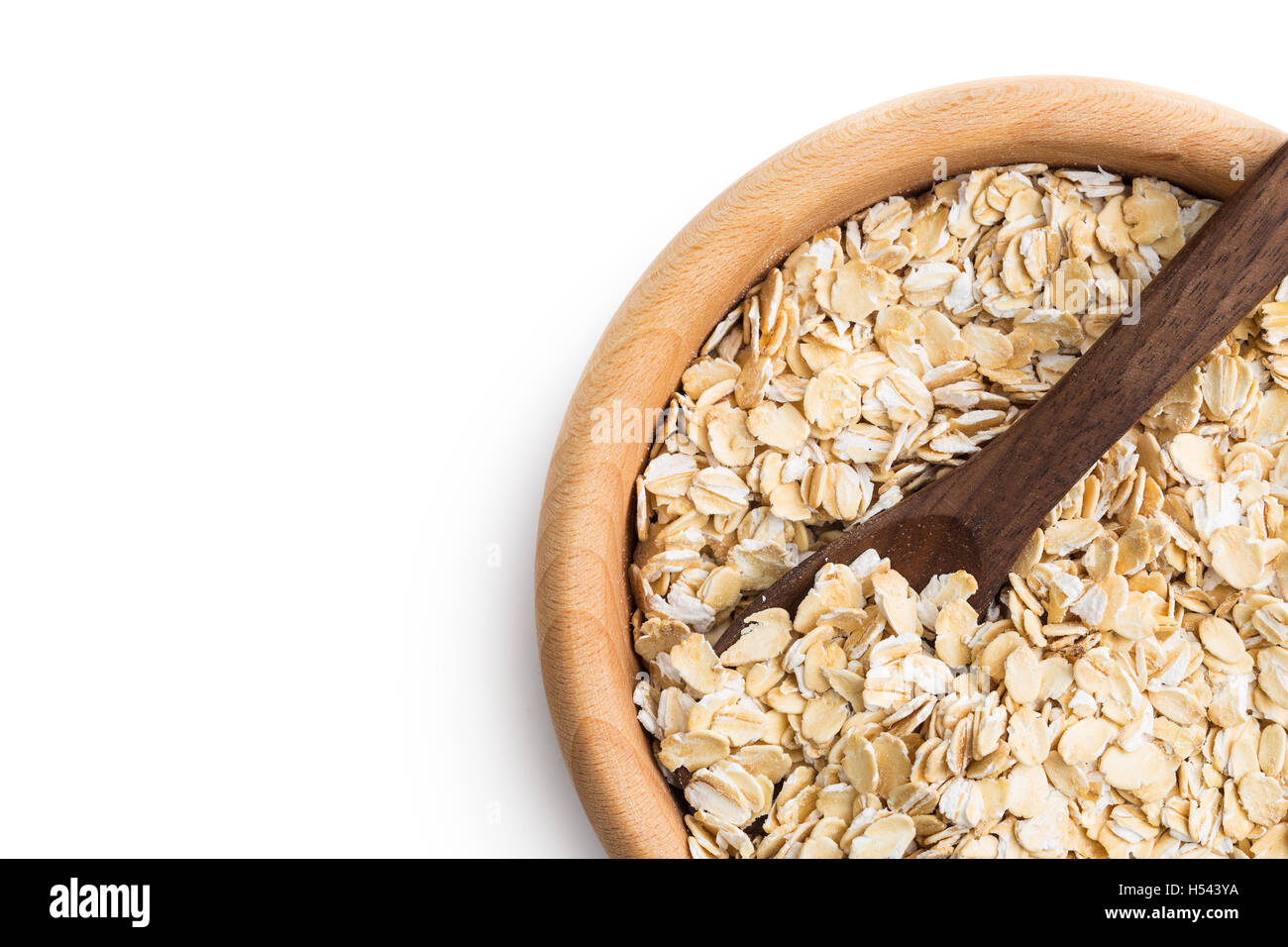 Dry rolled oatmeal in bowl. Isolated on white background Stock Photo ...