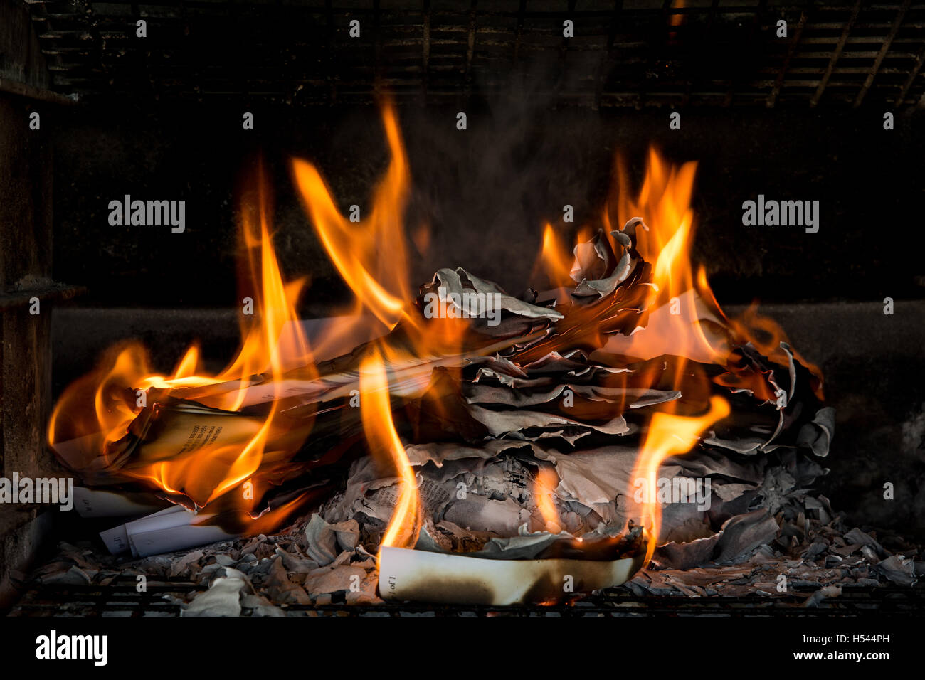 Burning Documents - destroying evidence with fire Stock Photo - Alamy