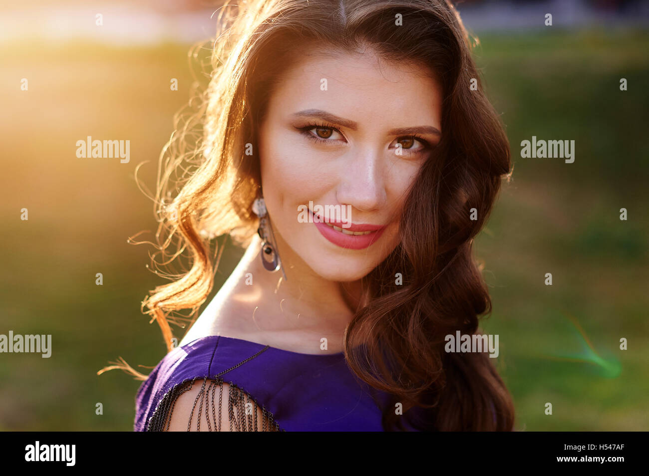 beautiful smiling woman walking in the park Stock Photo - Alamy