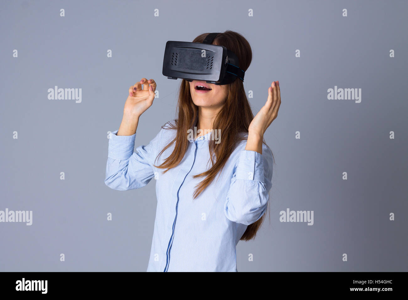Woman using VR glasses Stock Photo - Alamy