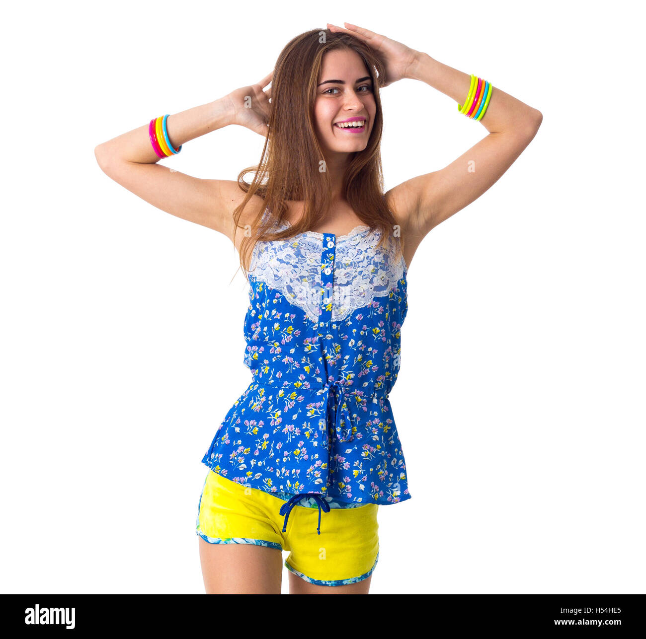 Woman holding hands on her head Stock Photo - Alamy
