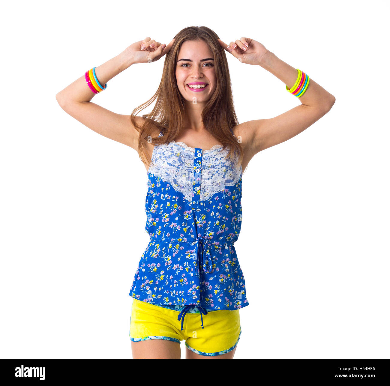Woman holding hands on her head Stock Photo - Alamy