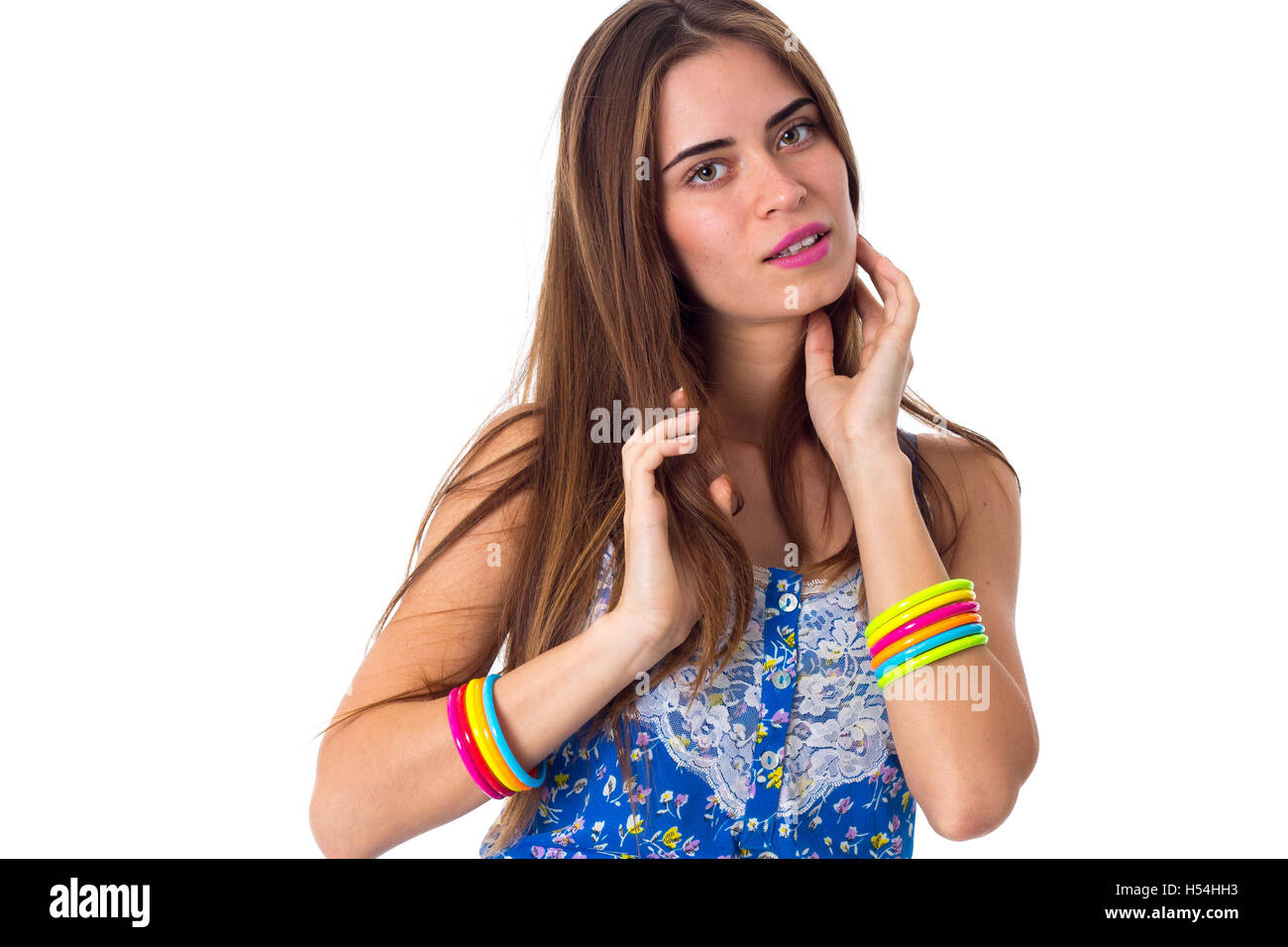 Young woman fixing her hair Stock Photo - Alamy