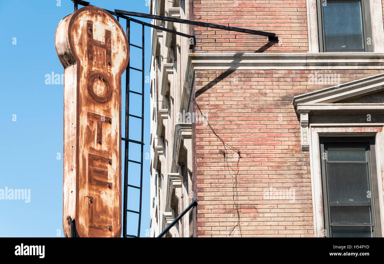 Rusty Hotel sign hanging from the side of the abandoned Keller Hotel in ...