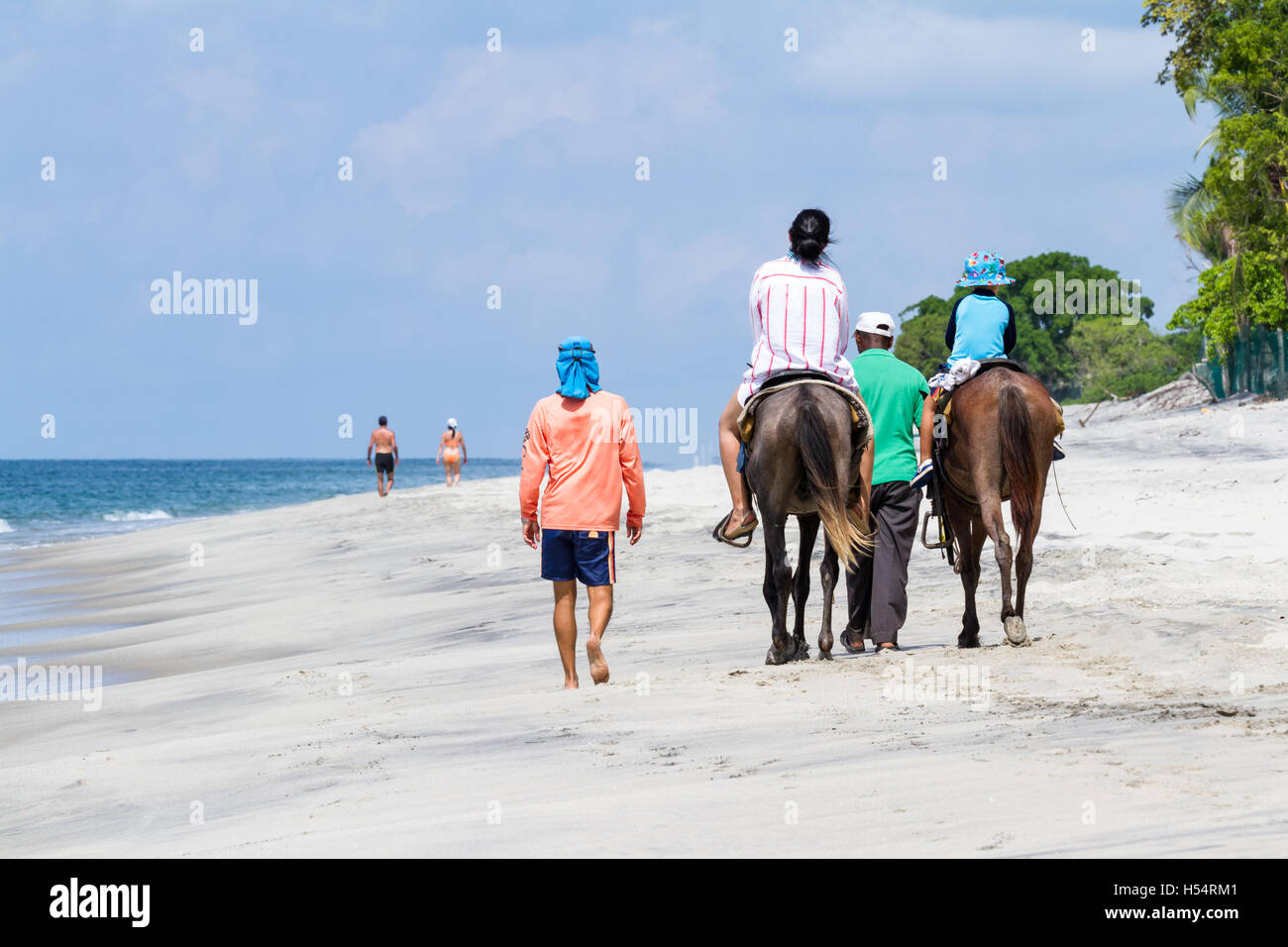 Santa Clara, Panama- June 12: young boy and his mom horseback riding on ...