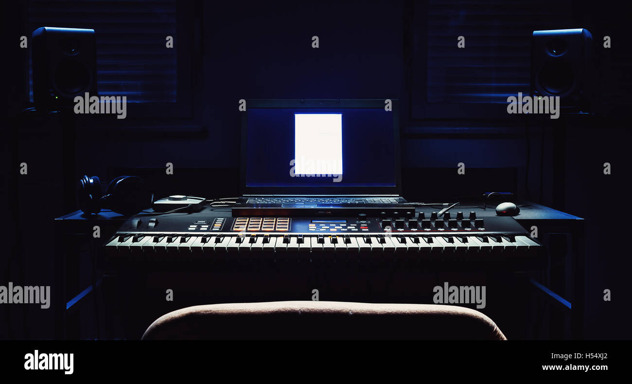 Details of a home studio, dark room with accentuated equipment shapes ...