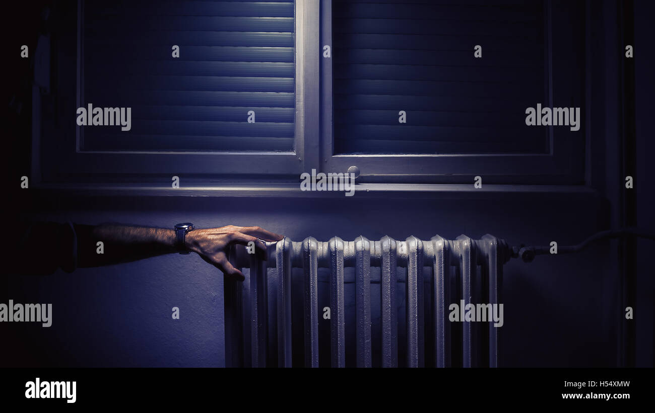 Conceptual composition about cold weather, male hand on radiator Stock ...