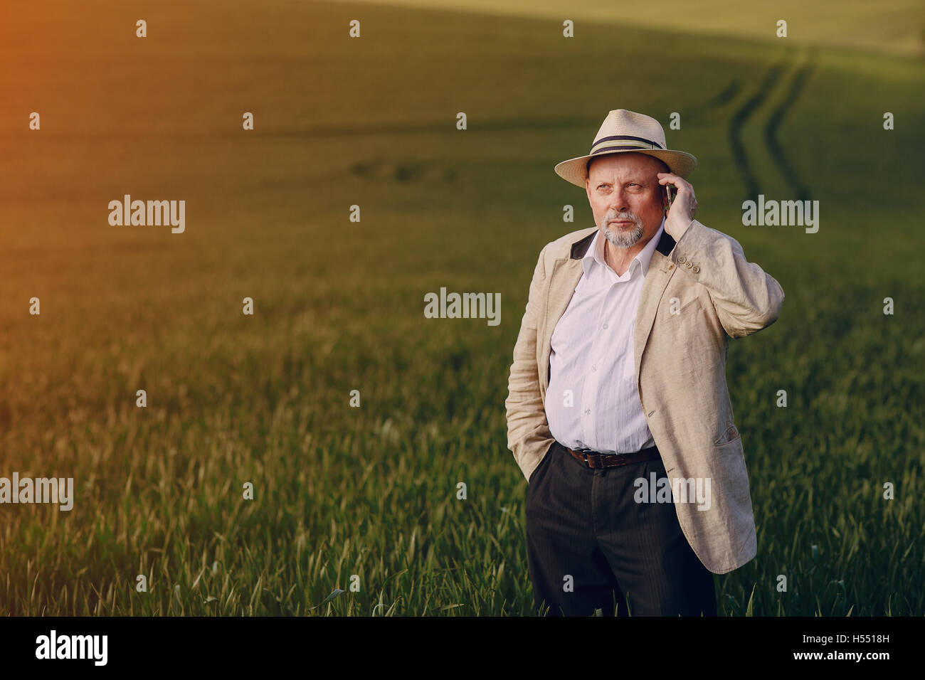 old man in field Stock Photo - Alamy
