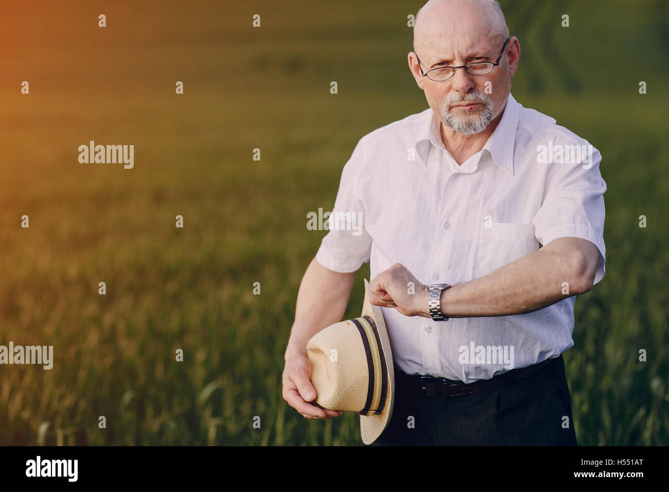 old man in field Stock Photo - Alamy