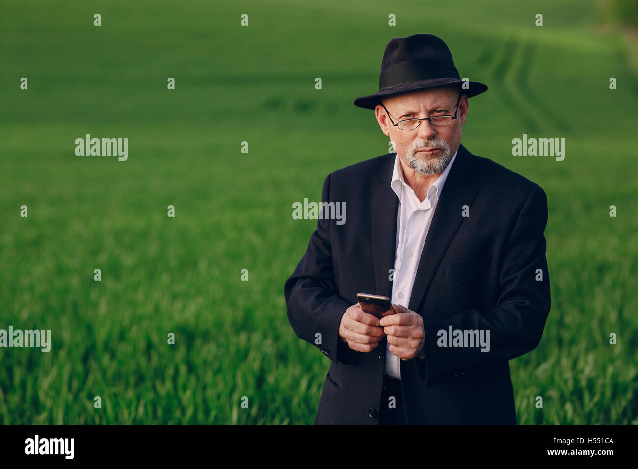 old man in field Stock Photo - Alamy