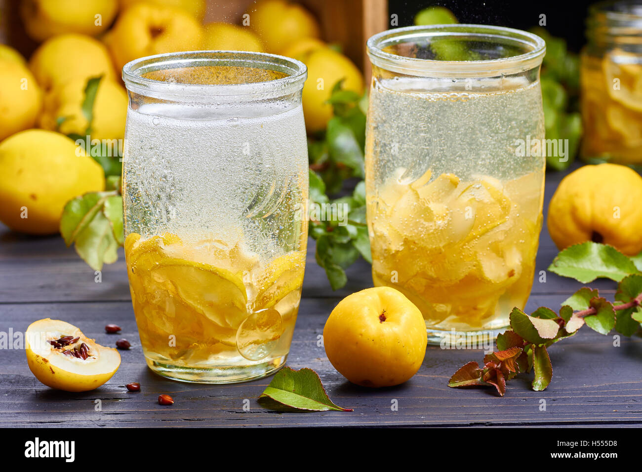 carbonated drink with syrup of japanese quince on fresh fruits ...