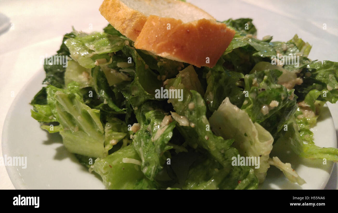 Tasty Caesar Salad with crusty bread Stock Photo - Alamy