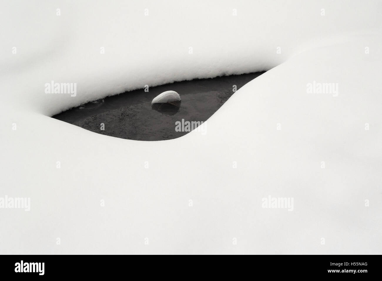 Stream under the snow in the form of an eye Stock Photo - Alamy