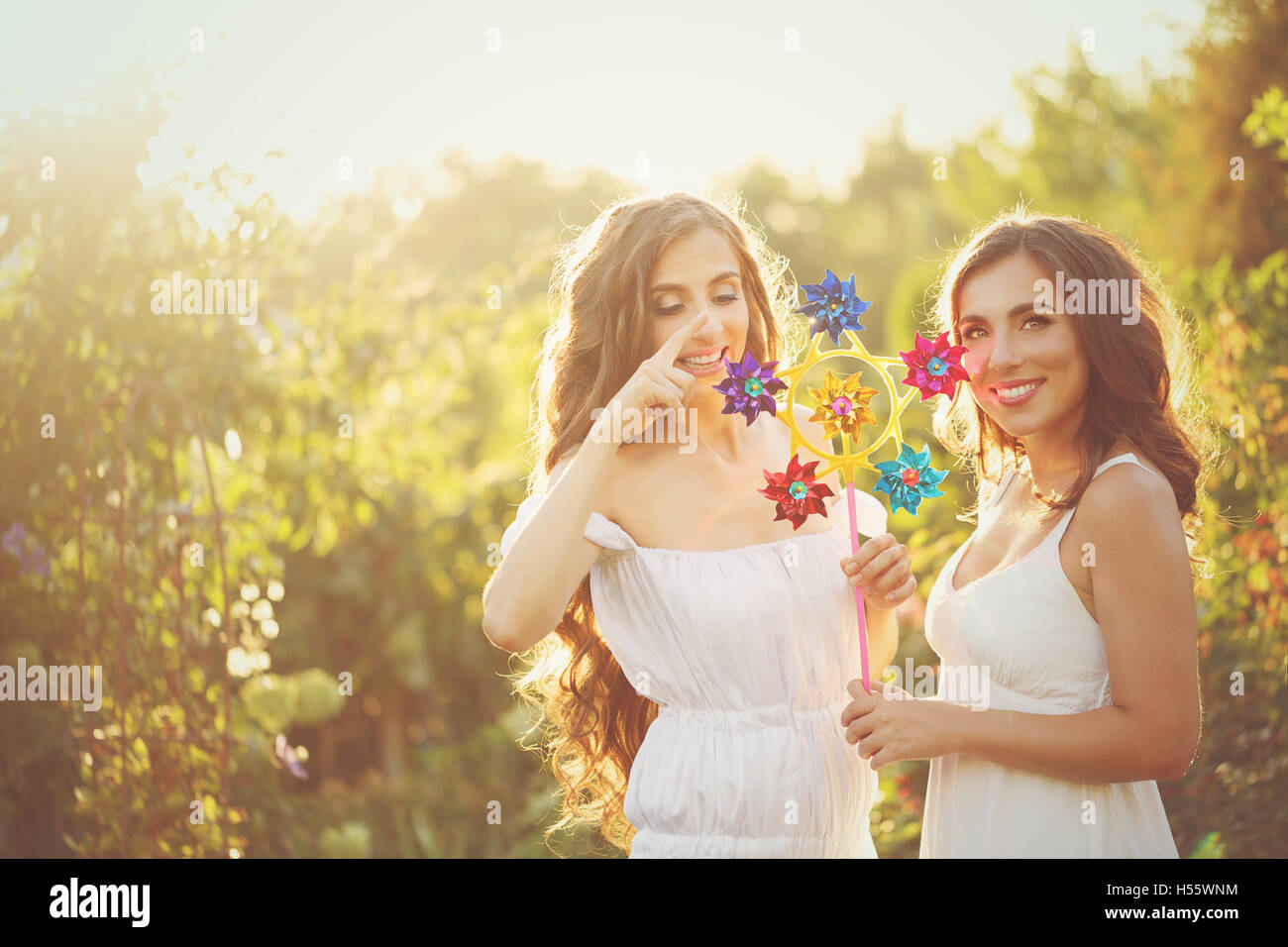 Girl with a pinwheel hi-res stock photography and images - Alamy
