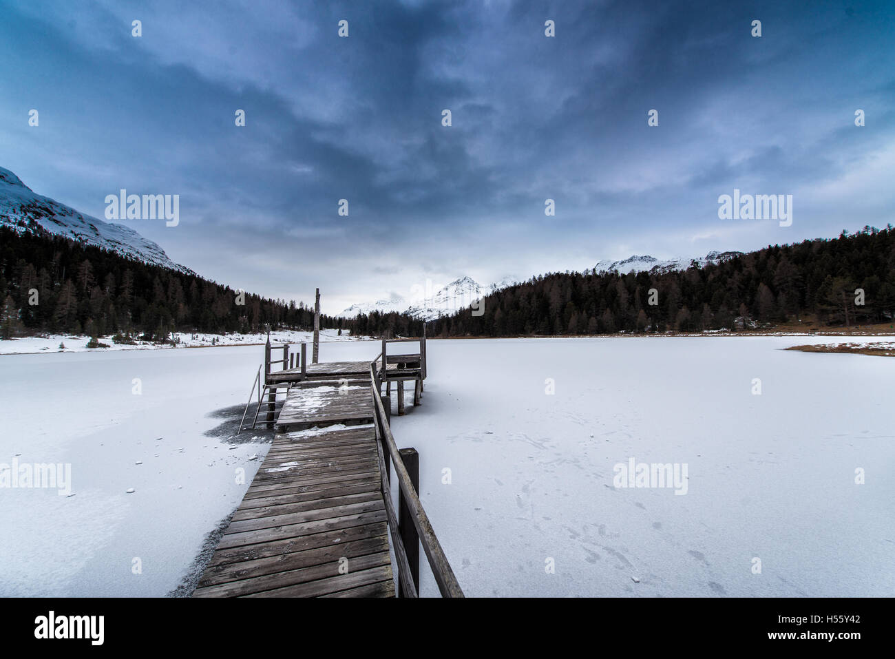 pier on frozen lake Stock Photo - Alamy