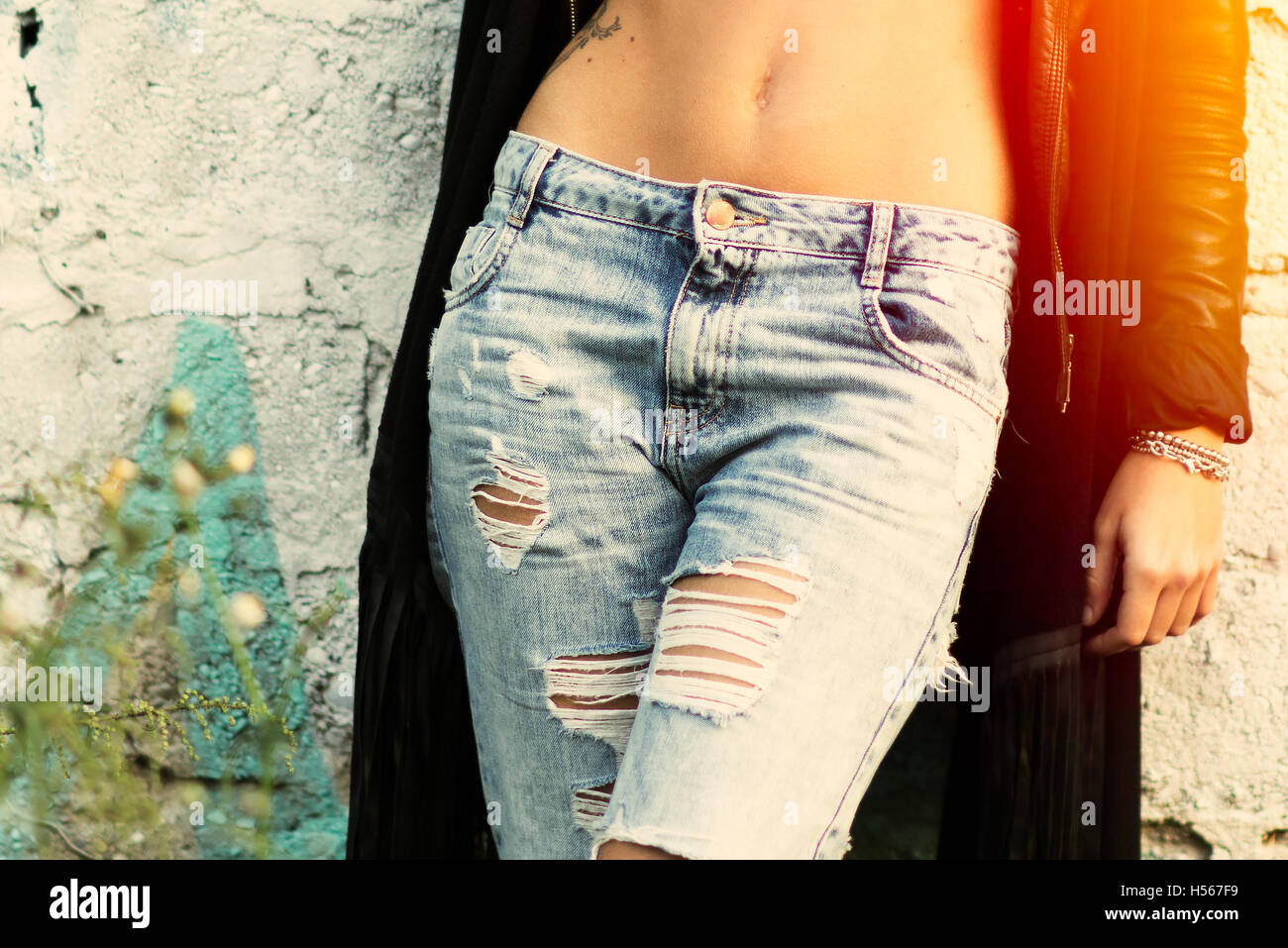 Ripped jeans girl vintage style Stock Photo - Alamy